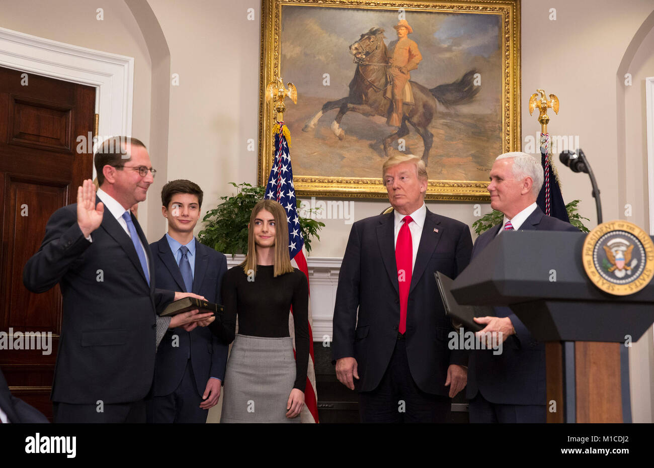 United States President Donald J. Trump looks on as Alex Azar is sworn ...