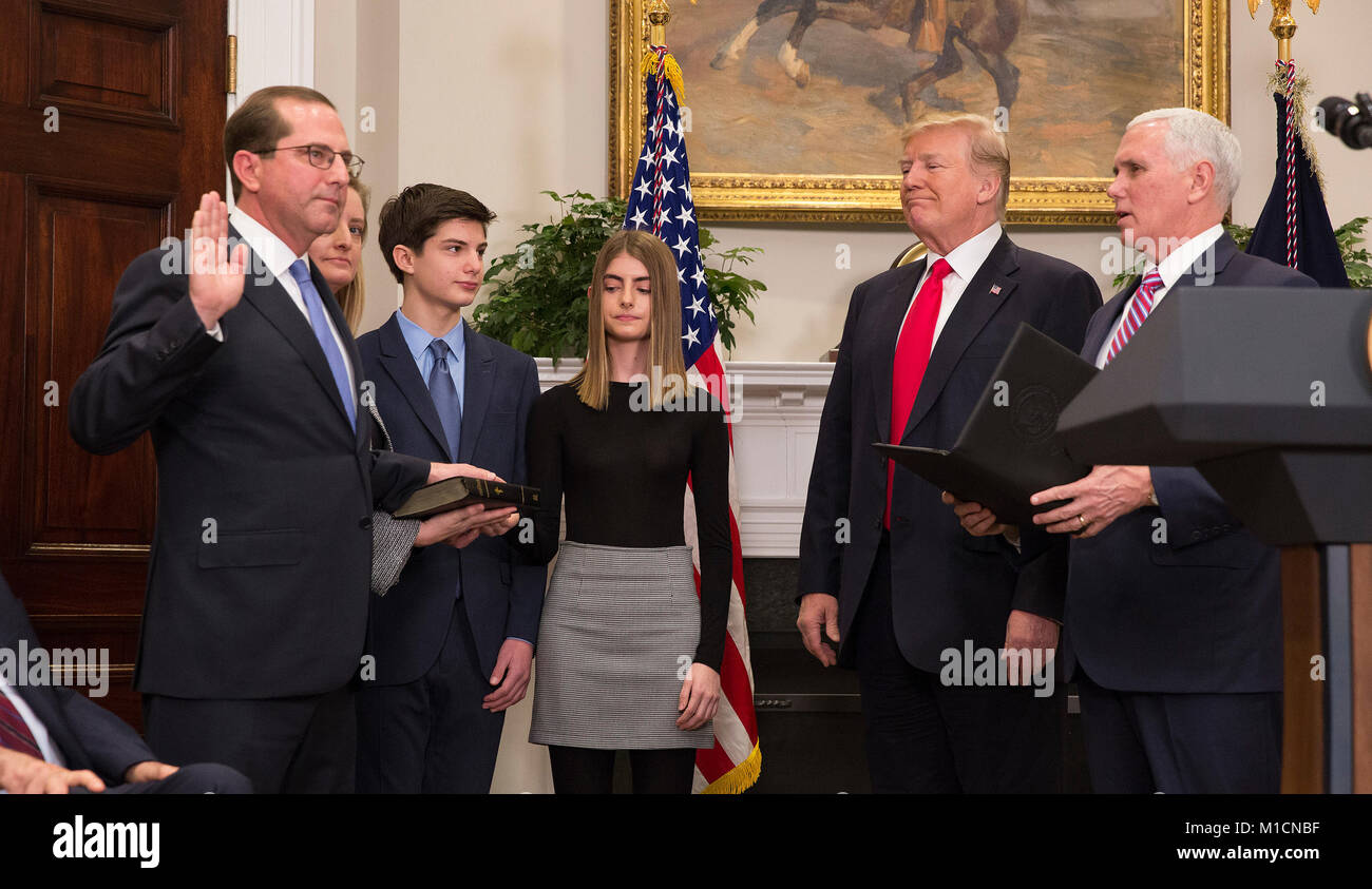 United States President Donald J. Trump looks on as Alex Azar is sworn ...