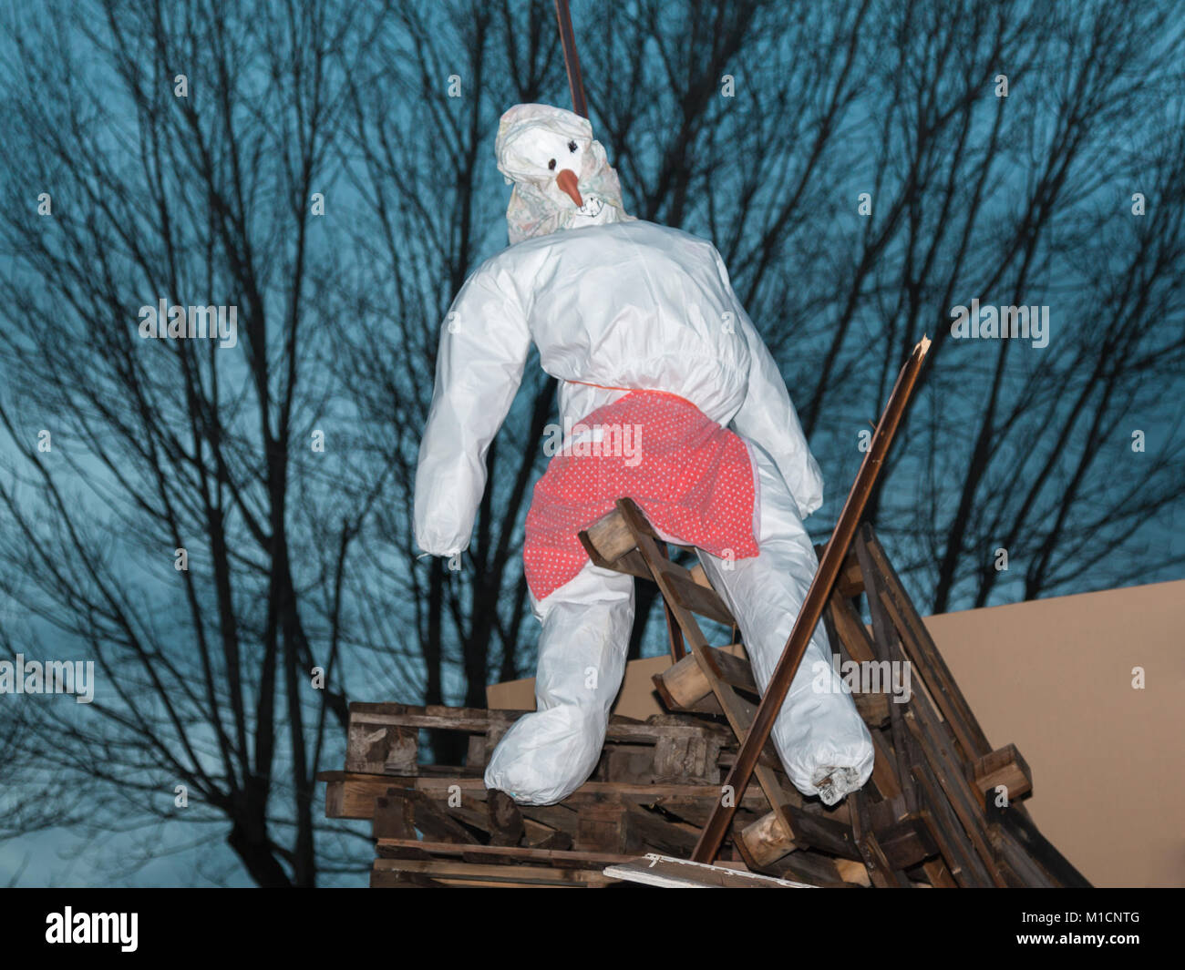 White Puppet Ready to be Burned in Wood Campfire Stock Photo - Alamy
