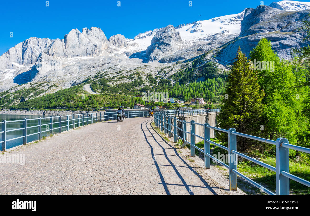 Motorcyclists on mountain road, Passo Fedaia (Fedaia Pass), at the foot ...