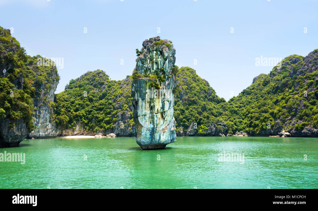 Limestone rocks and calm sea of Halong bay in Vietnam Stock Photo - Alamy