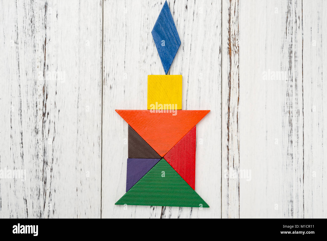wooden tangram in a candle shape Stock Photo - Alamy