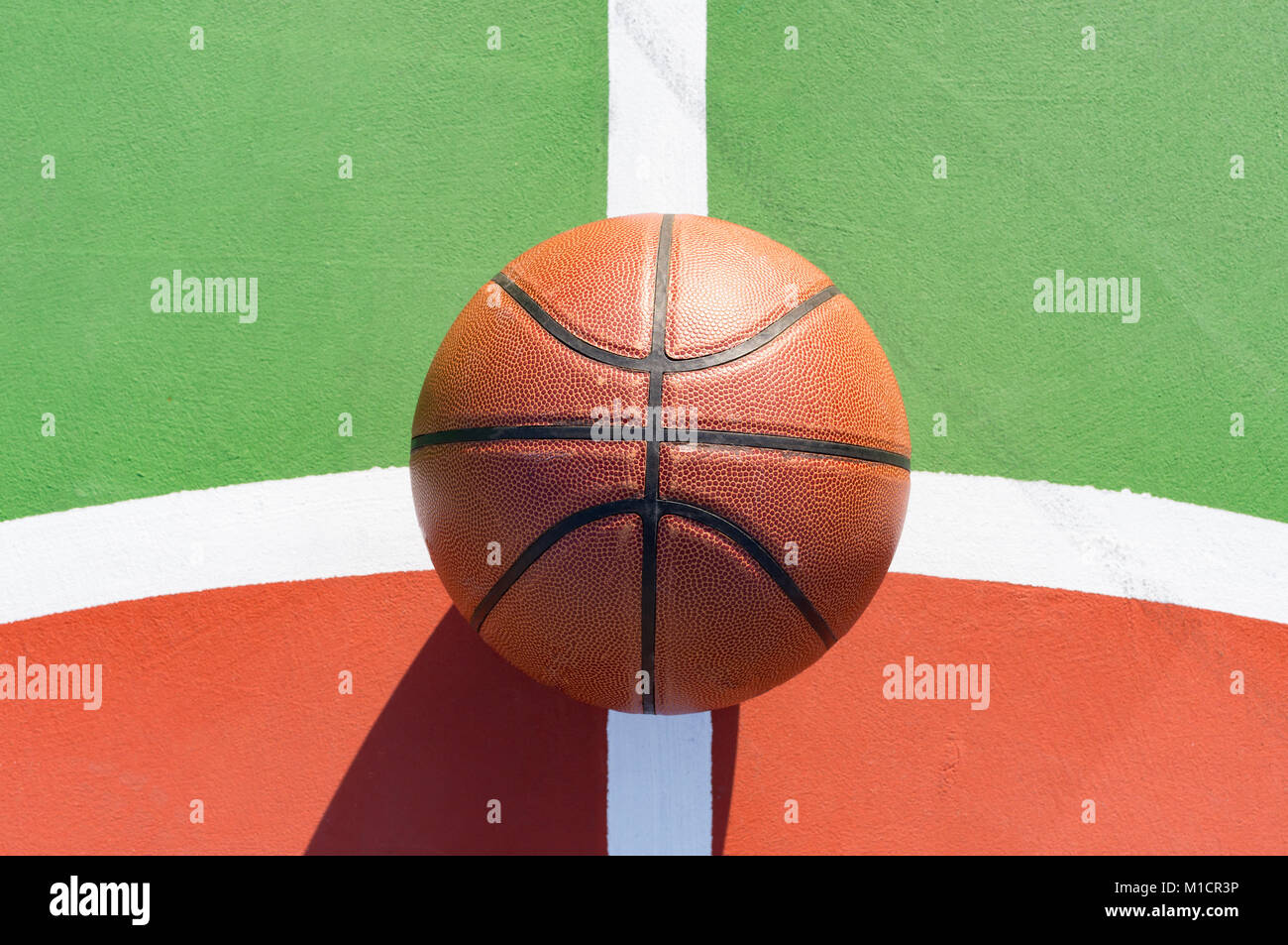 basketball on an outdoor playing field in a day time Stock Photo - Alamy
