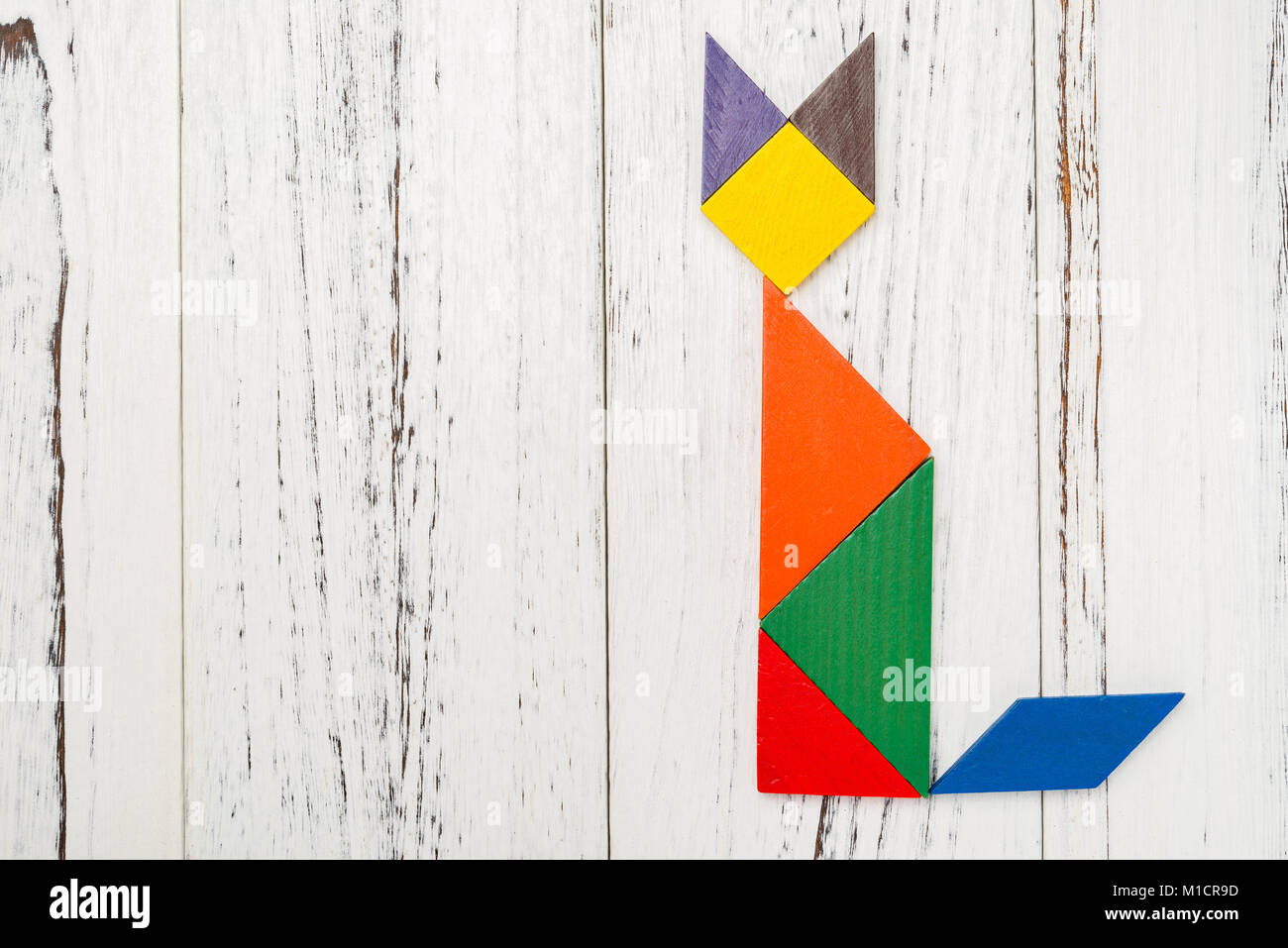 wooden tangram shaped like a fox with copy space Stock Photo - Alamy