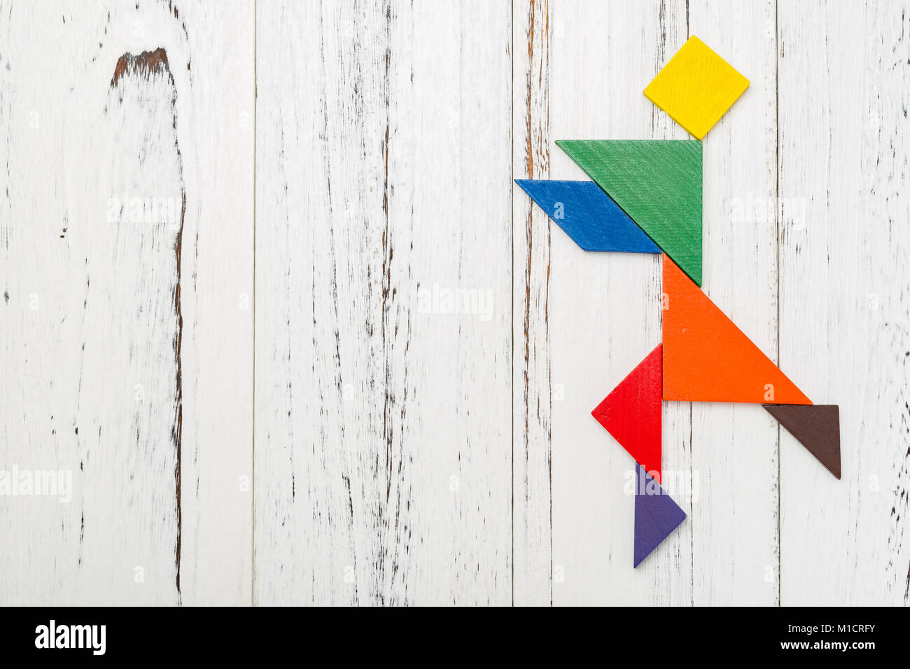 wooden tangram in a dancing people shape with copy space Stock Photo ...