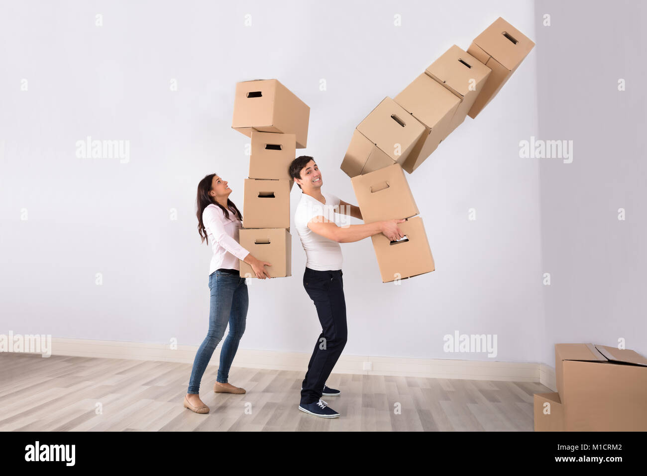 Delivery man falling stack boxes hi-res stock photography and images ...
