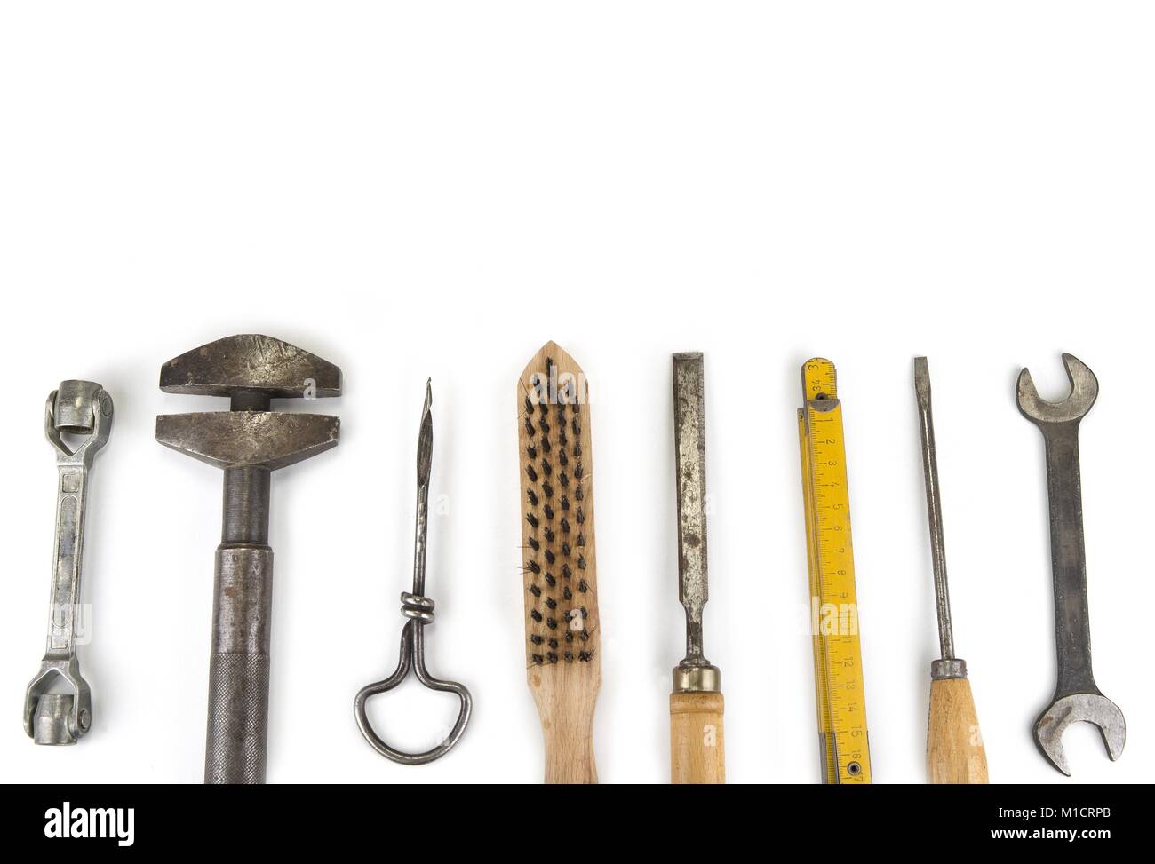 Old handyman tools on the white background Stock Photo - Alamy