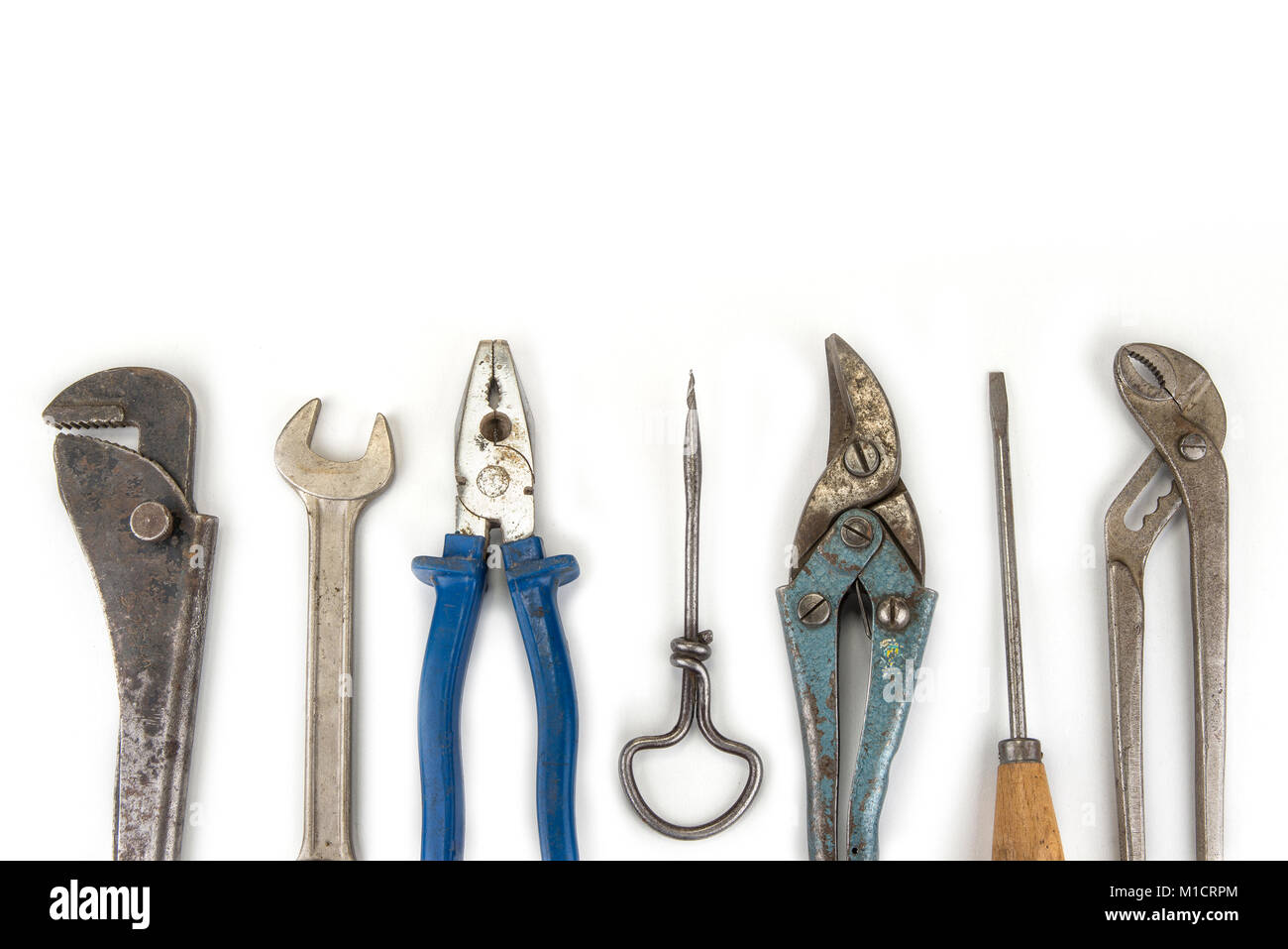 Old handyman tools on the white background Stock Photo - Alamy