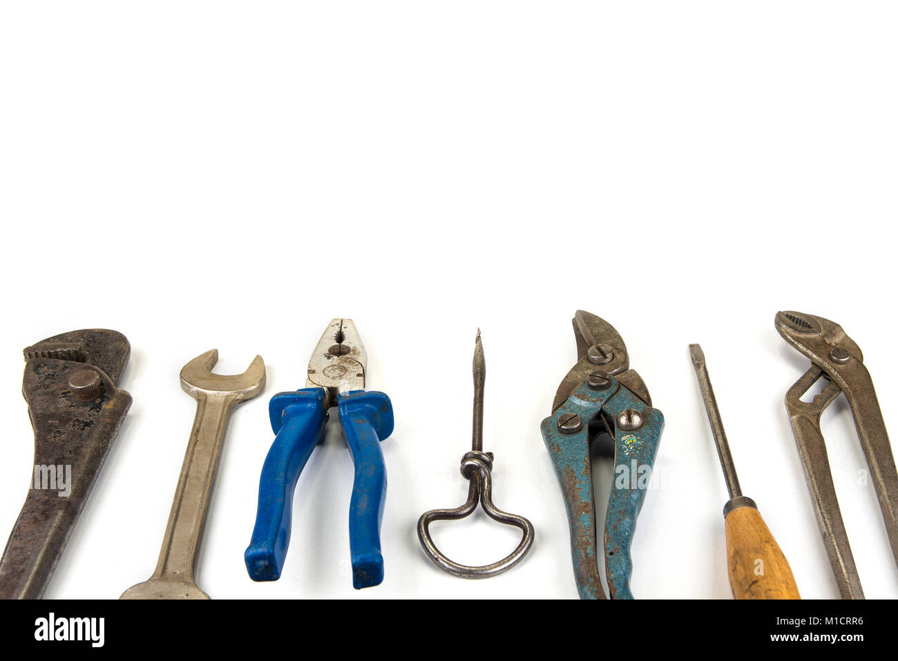 Old handyman tools on the white background Stock Photo - Alamy