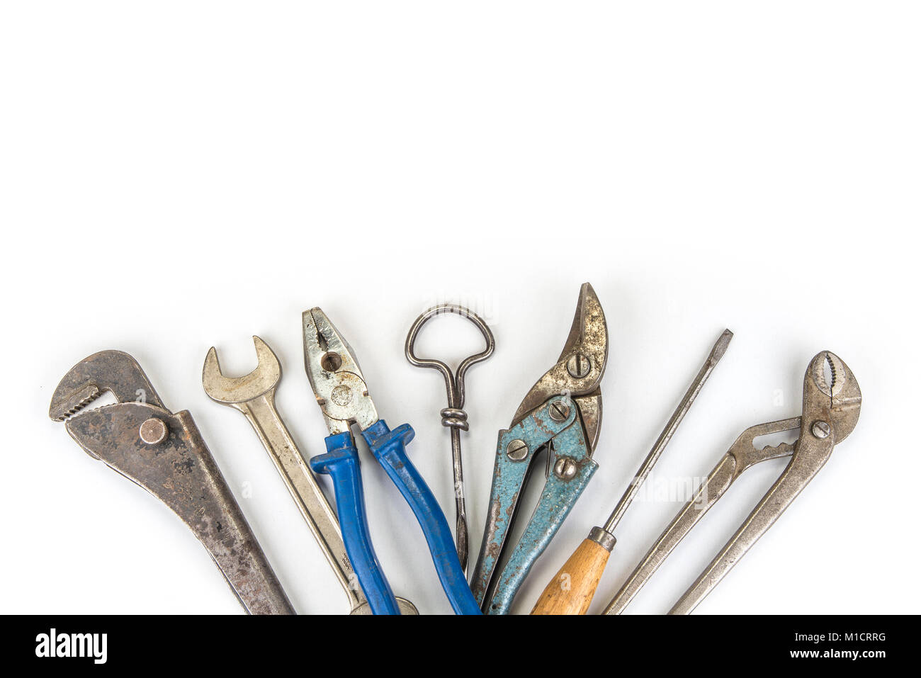 Old handyman tools on the white background Stock Photo - Alamy