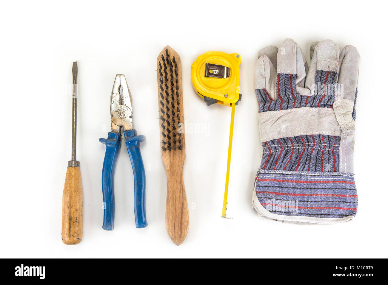 Old handyman tools with gloves on the white background Stock Photo - Alamy