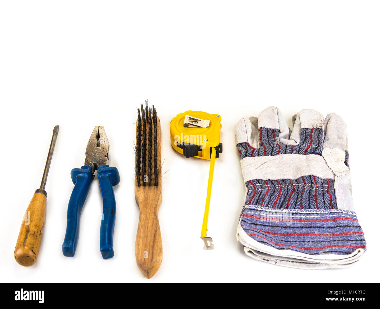 Old handyman tools with gloves on the white background Stock Photo - Alamy