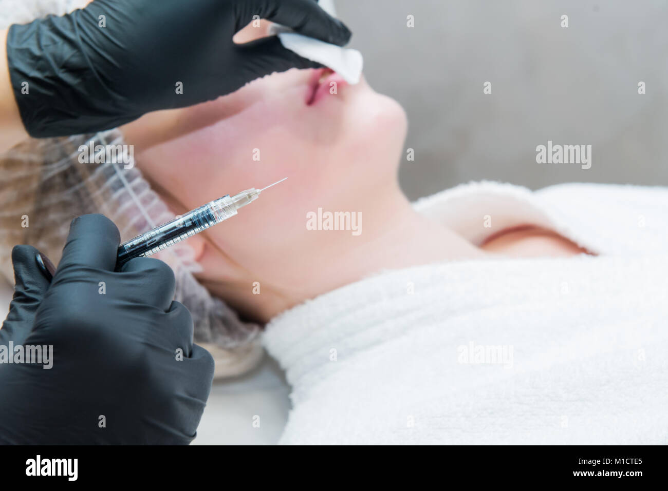 Contour plastic: Dermatologist doctor inject filler. Close up female ...