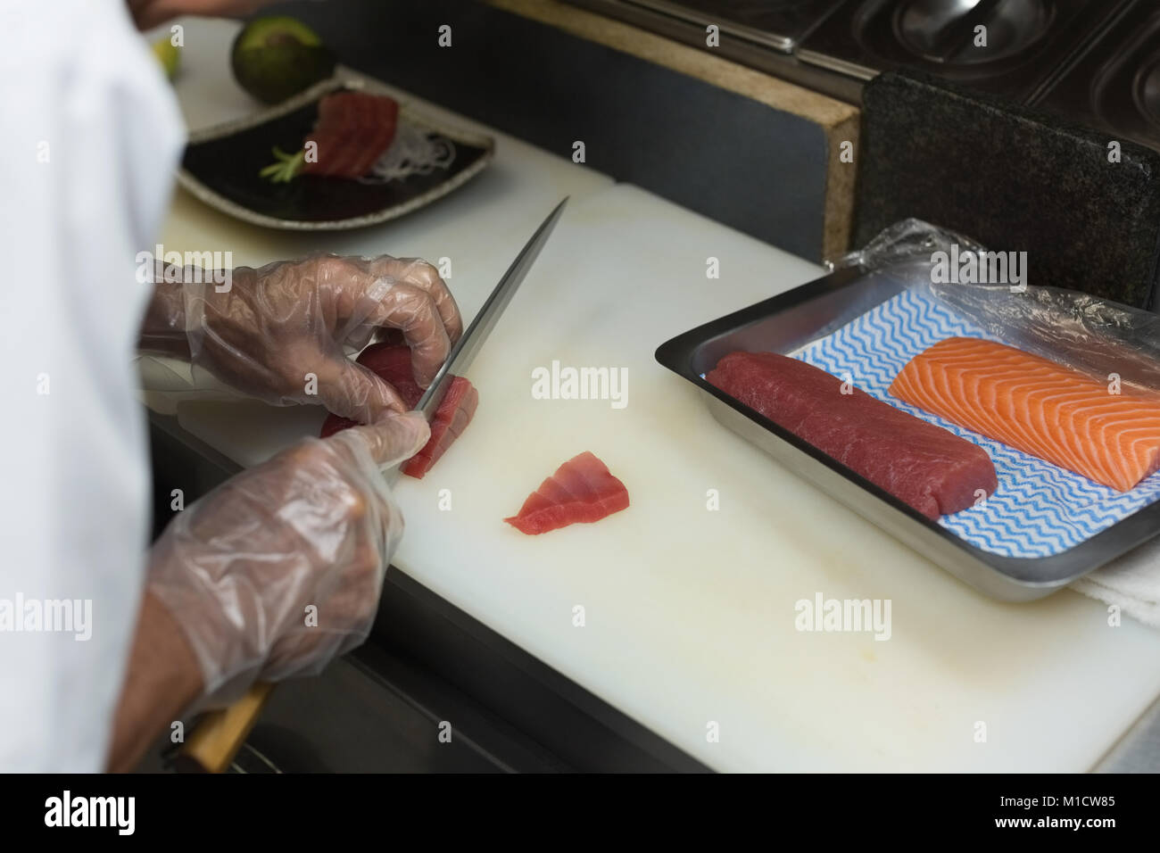 Chef preparing sushi in kitchen Stock Photo - Alamy