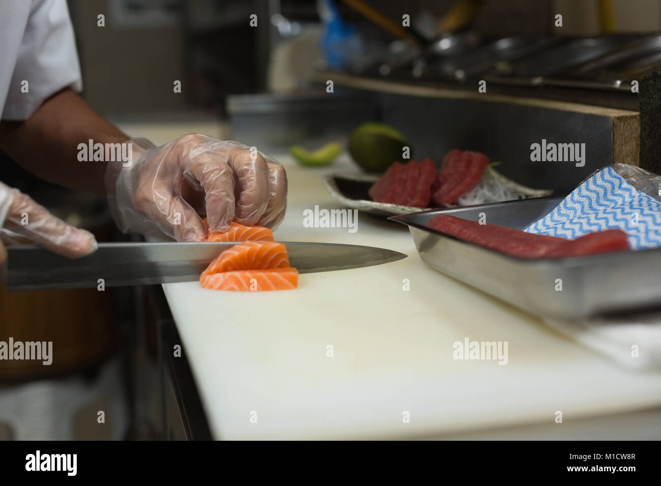 Chef preparing sushi in kitchen Stock Photo - Alamy