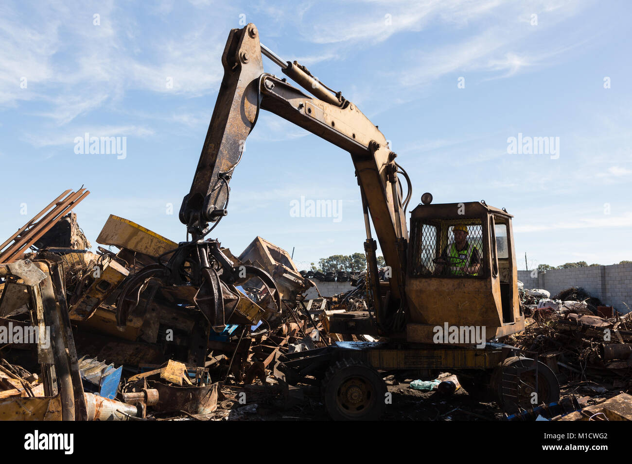Crane lifting scrap metal Stock Photo - Alamy
