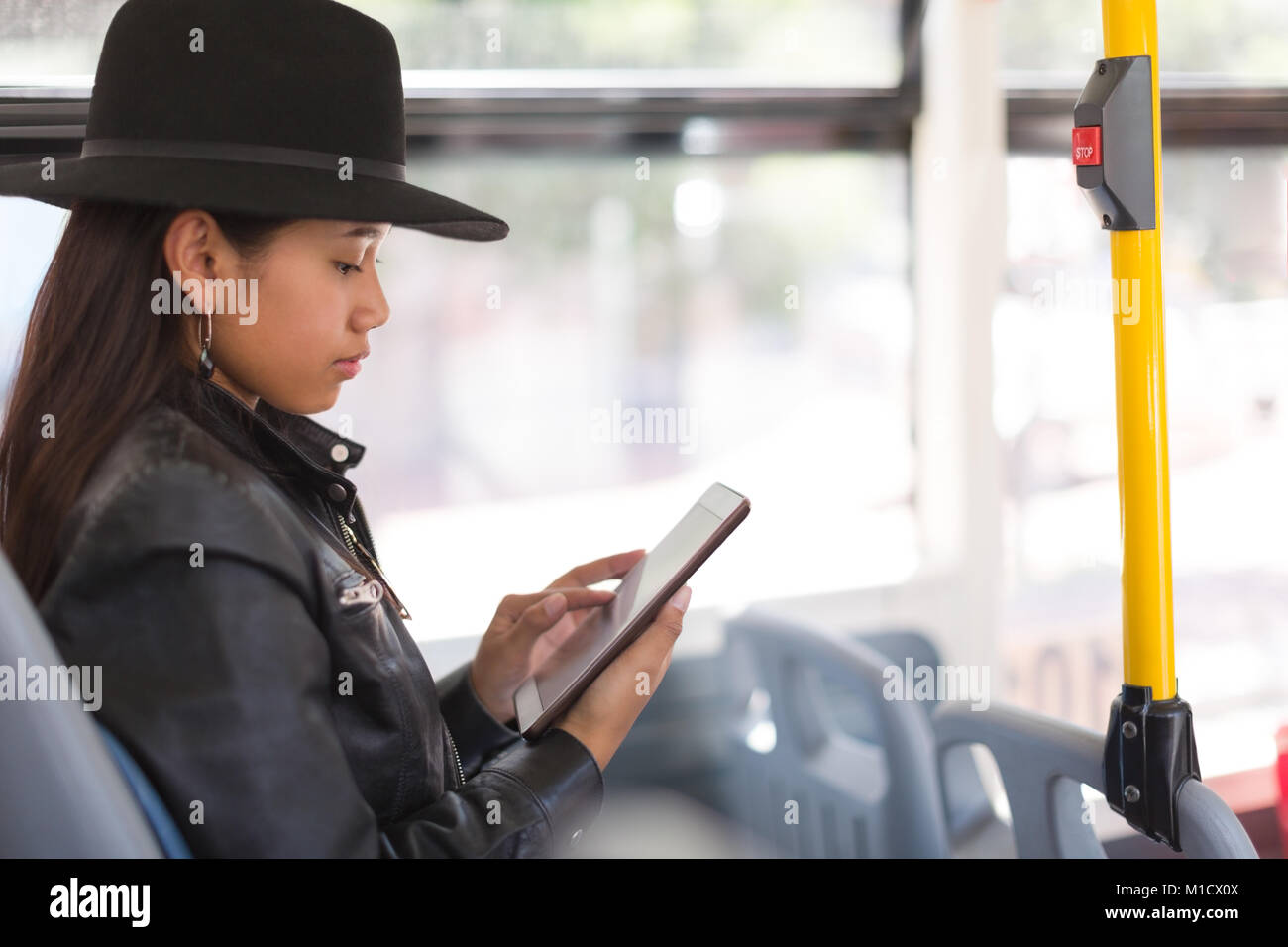 Teenage girl using digital tablet Stock Photo - Alamy