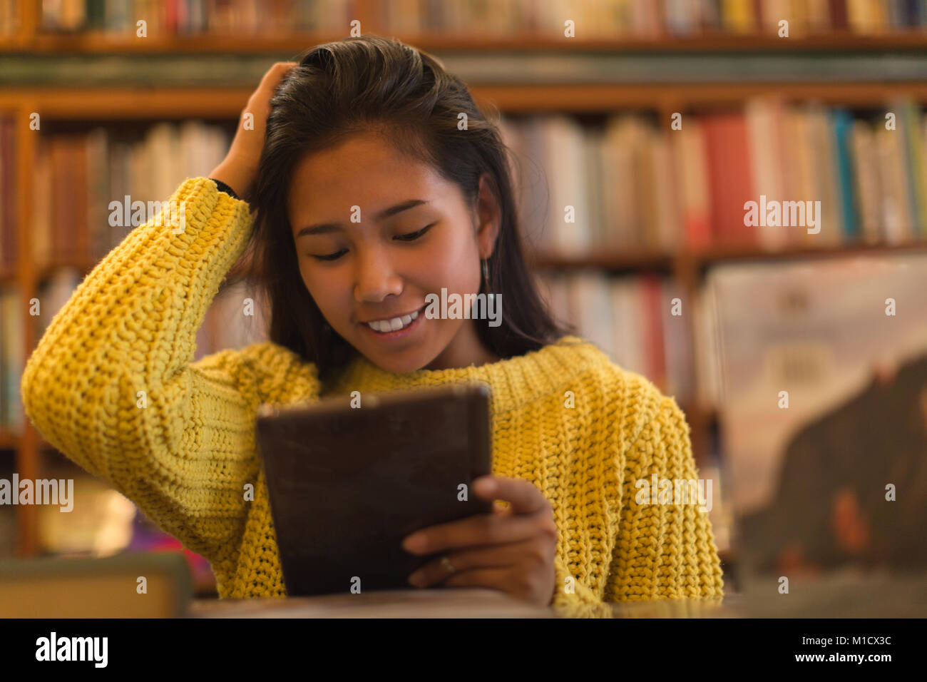 Teenage girl using digital tablet Stock Photo - Alamy