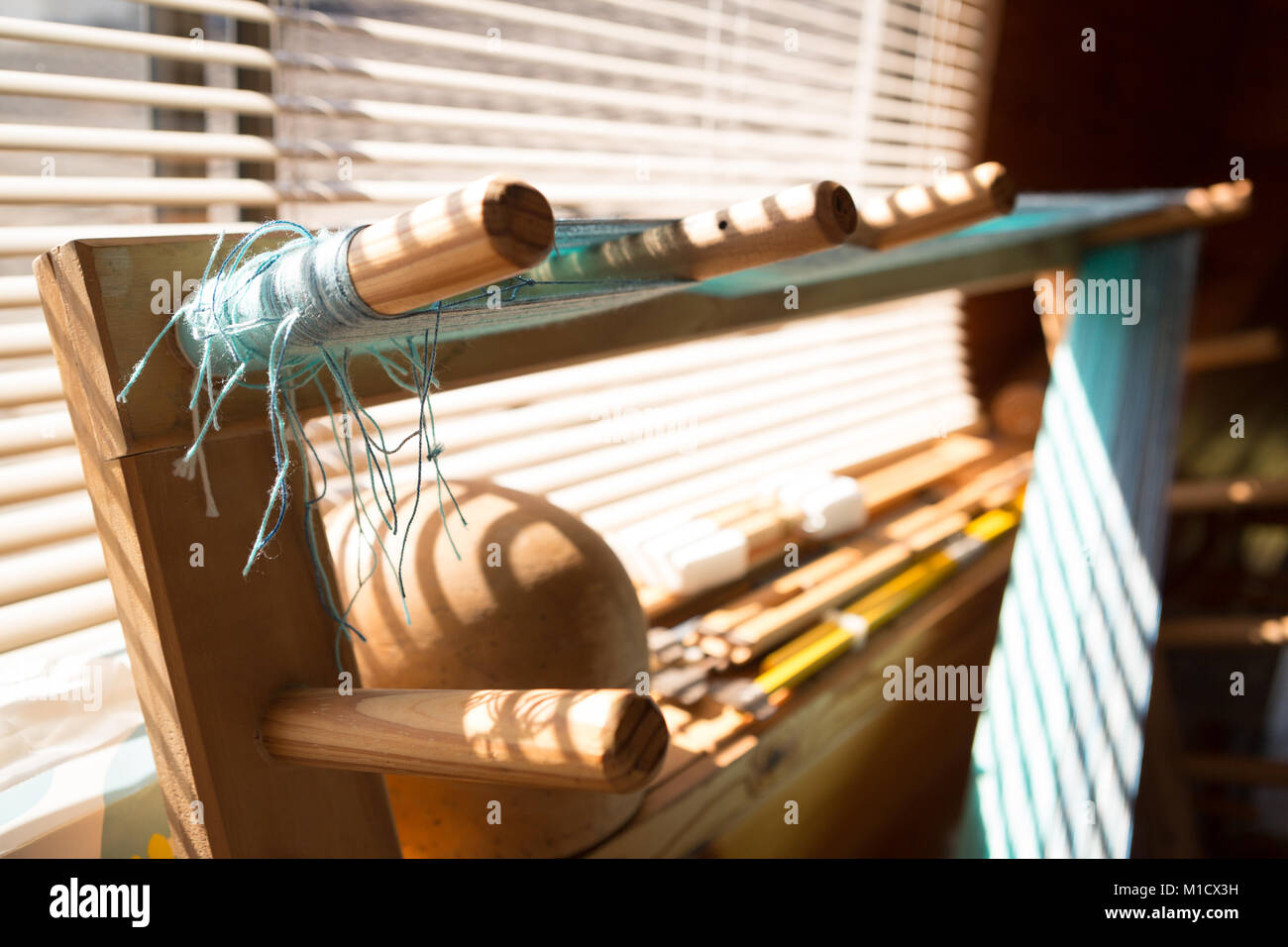 Machine with silk thread in factory Stock Photo - Alamy