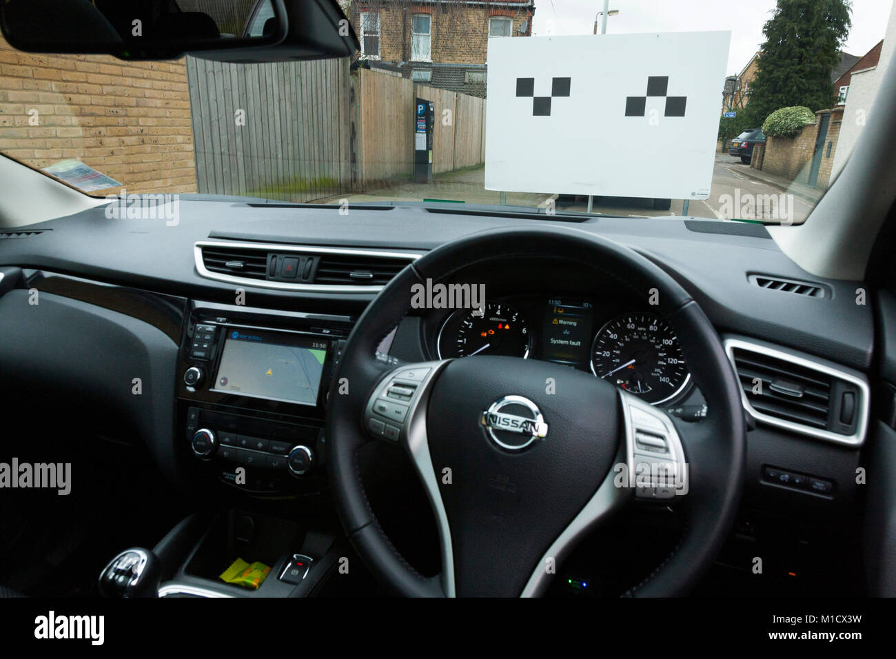 Nissan car having its ADAS camera recalibrated due to a replacement ...