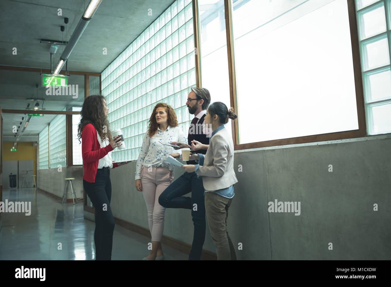 Female executives holding document hi-res stock photography and images ...