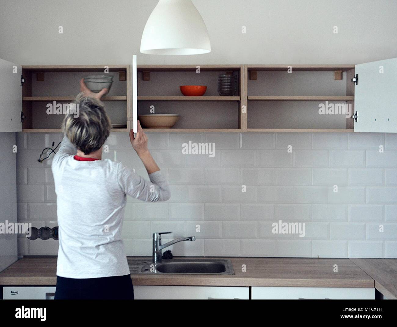 Cleaning And Storing In A New Kitchen Stock Photo Alamy
