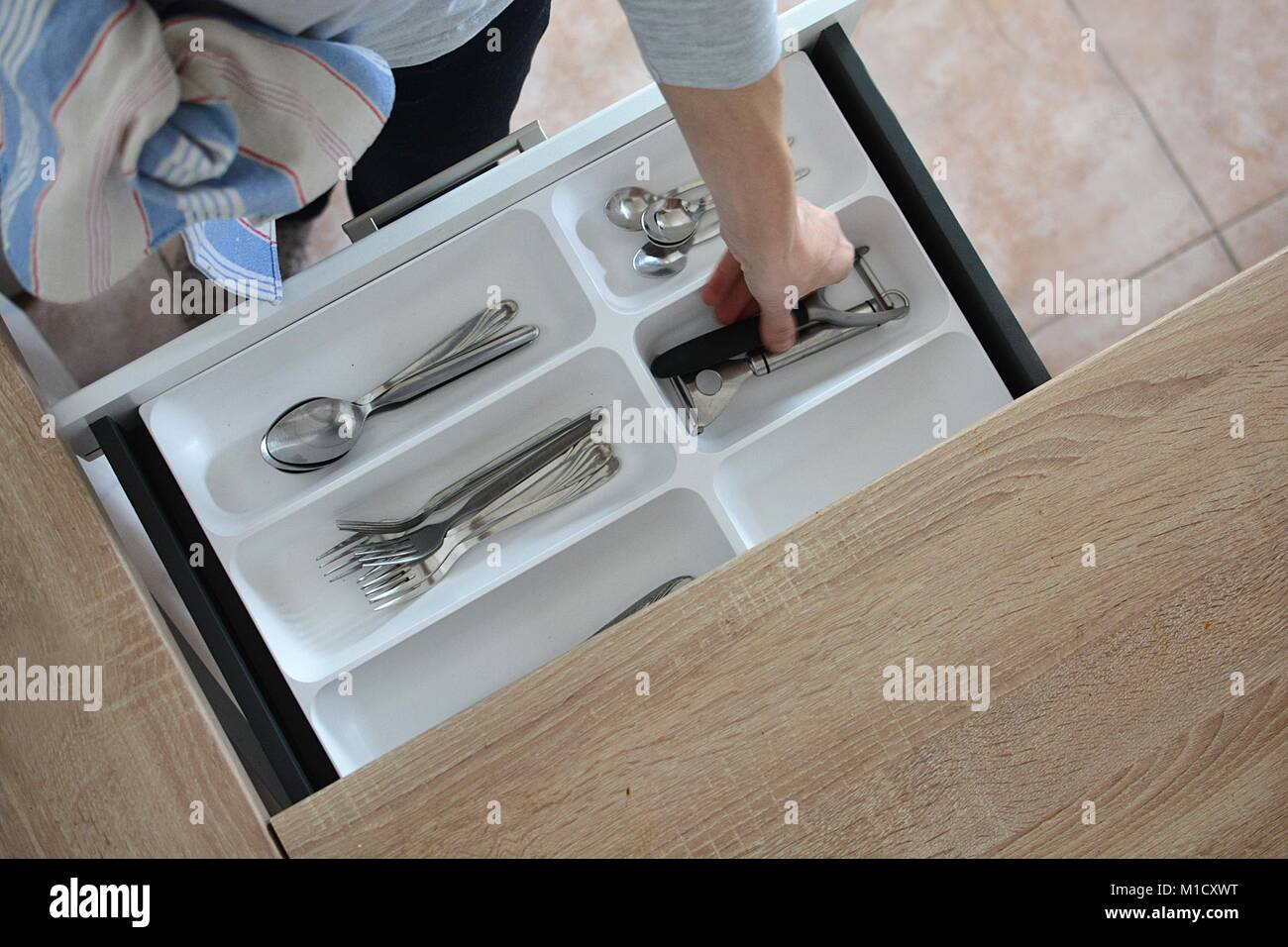Cleaning And Storing In A New Kitchen Stock Photo Alamy