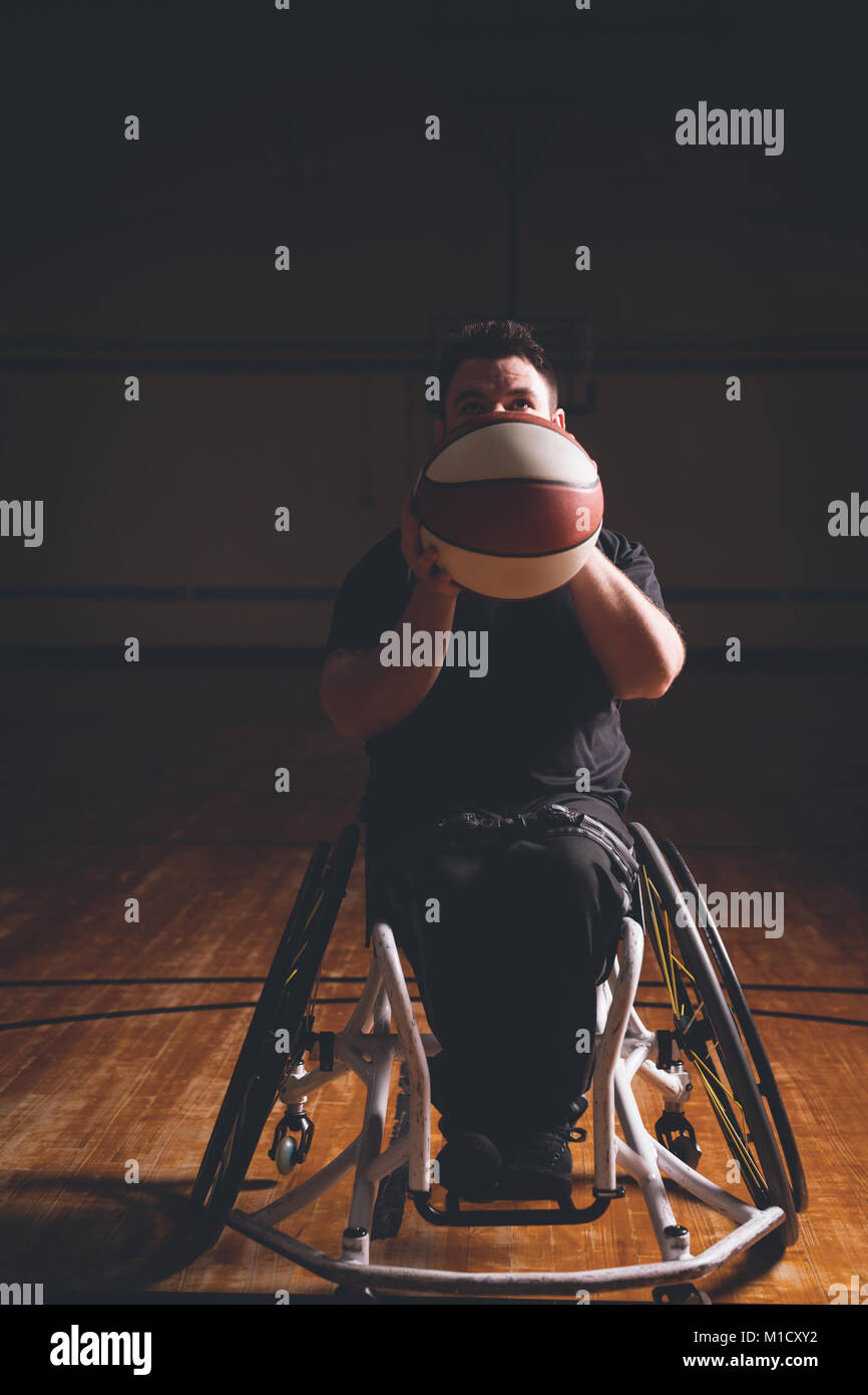 Disabled man practicing basketball in the court Stock Photo - Alamy