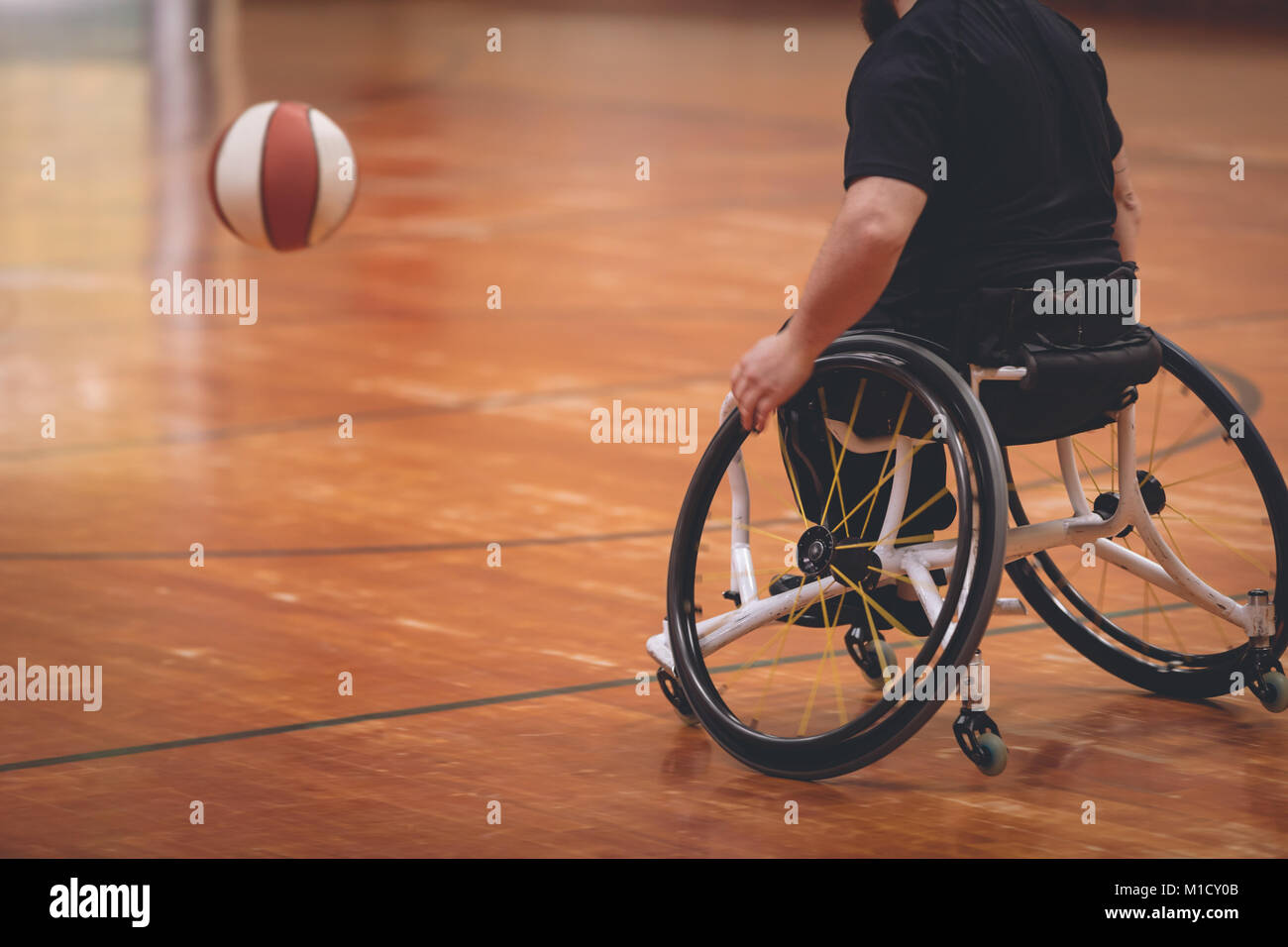 Disabled man practicing basketball in the court Stock Photo - Alamy