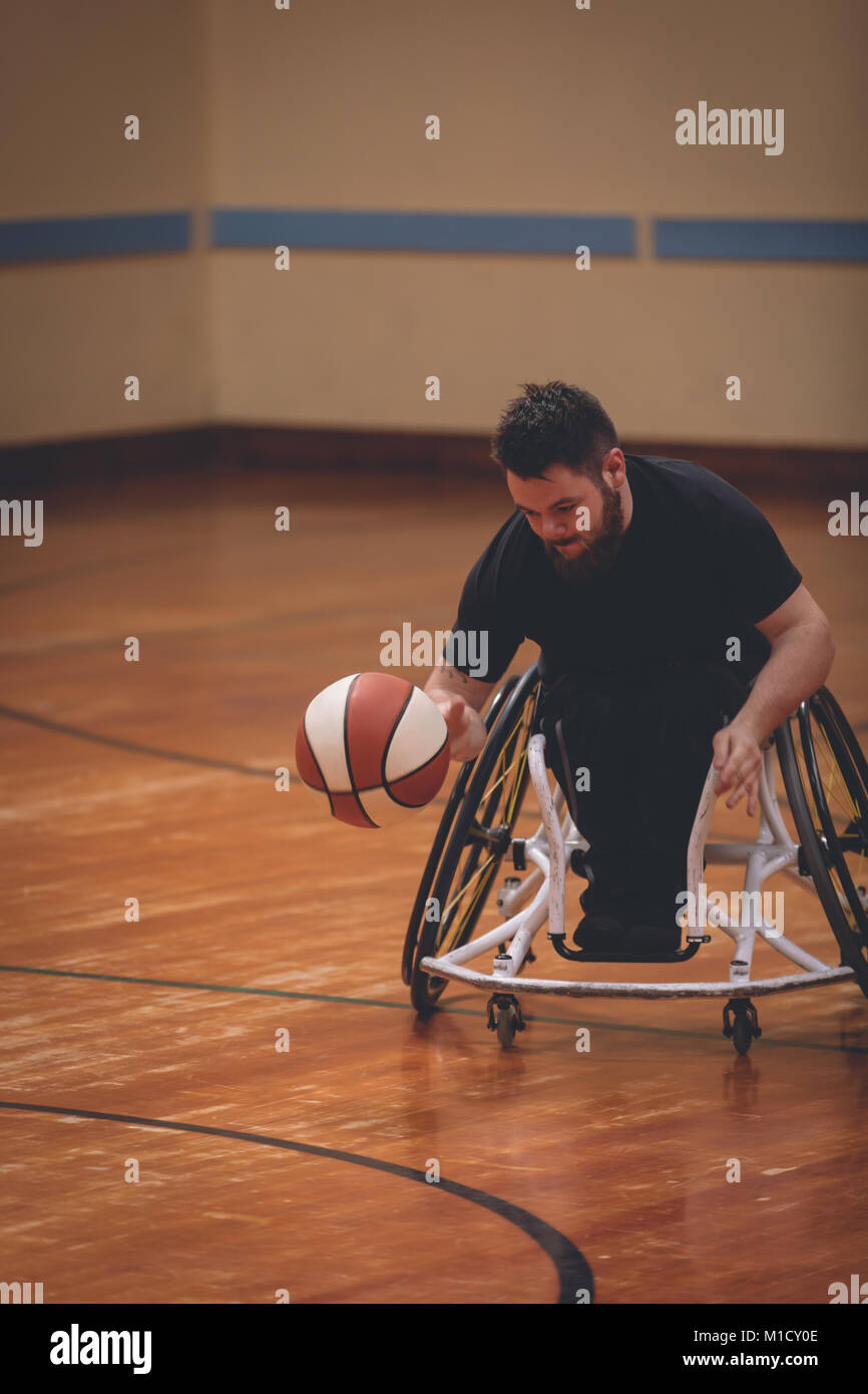 Disabled man practicing basketball in the court Stock Photo - Alamy