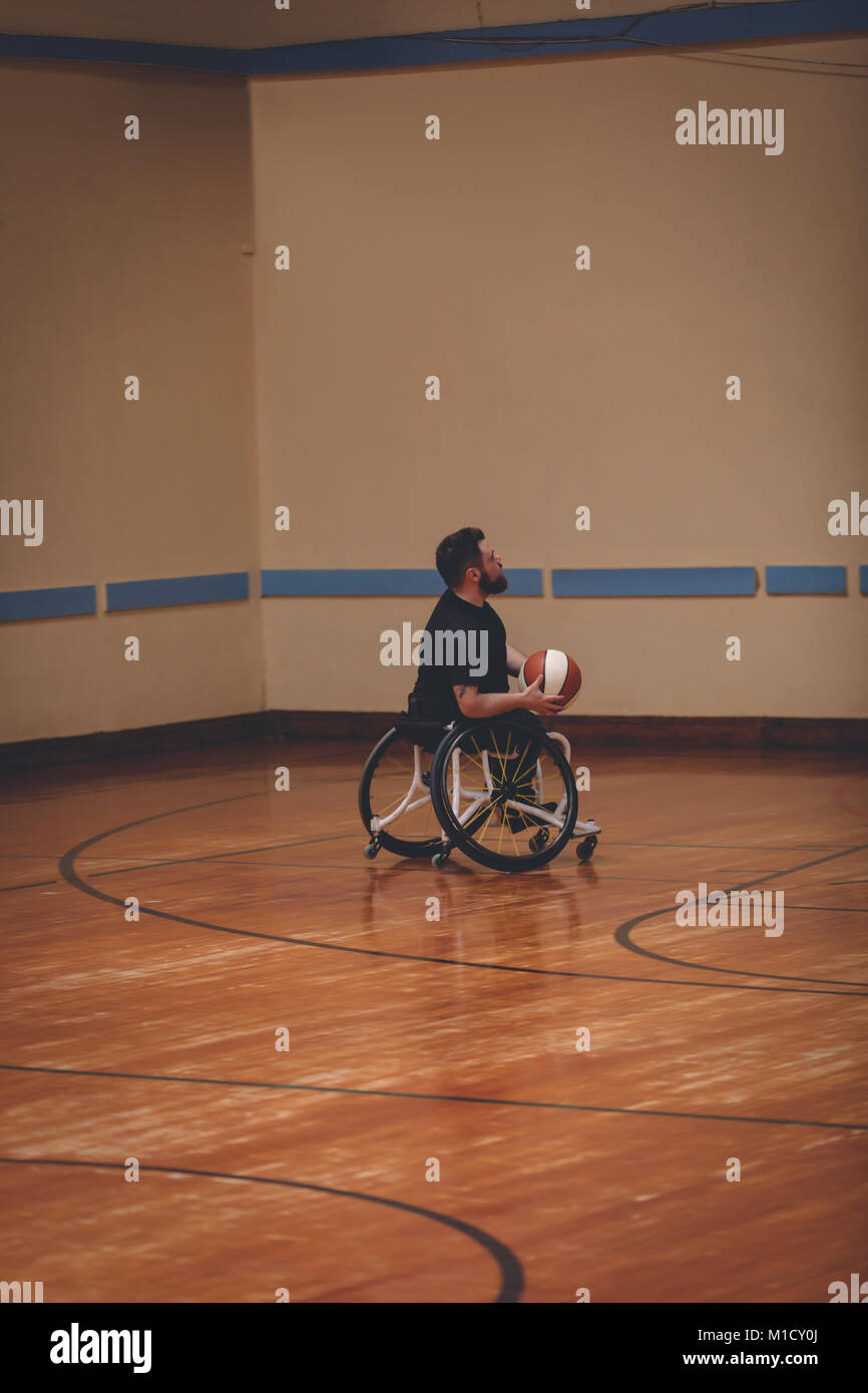 Disabled man practicing basketball in the court Stock Photo - Alamy