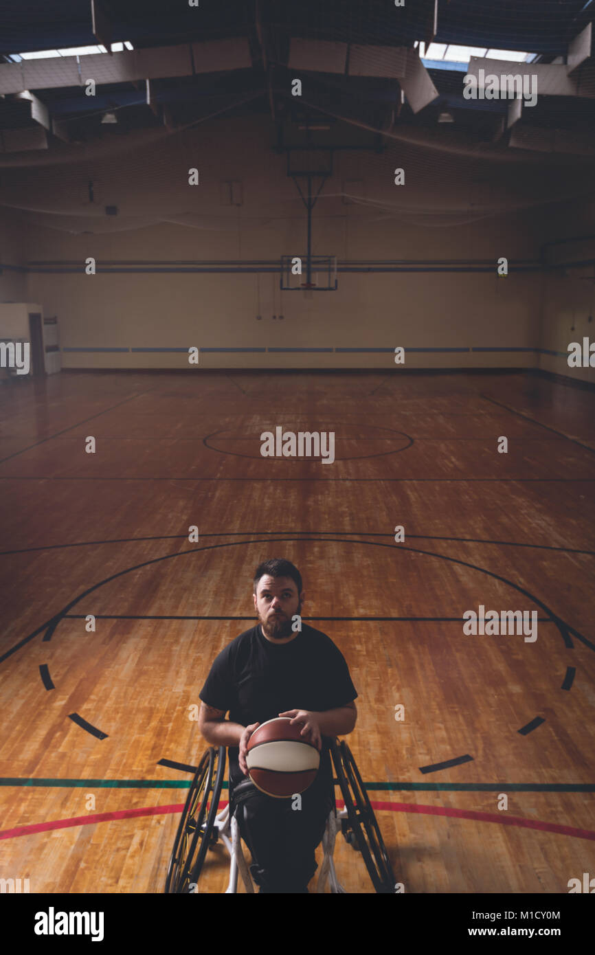 Disabled man practicing basketball in the court Stock Photo - Alamy