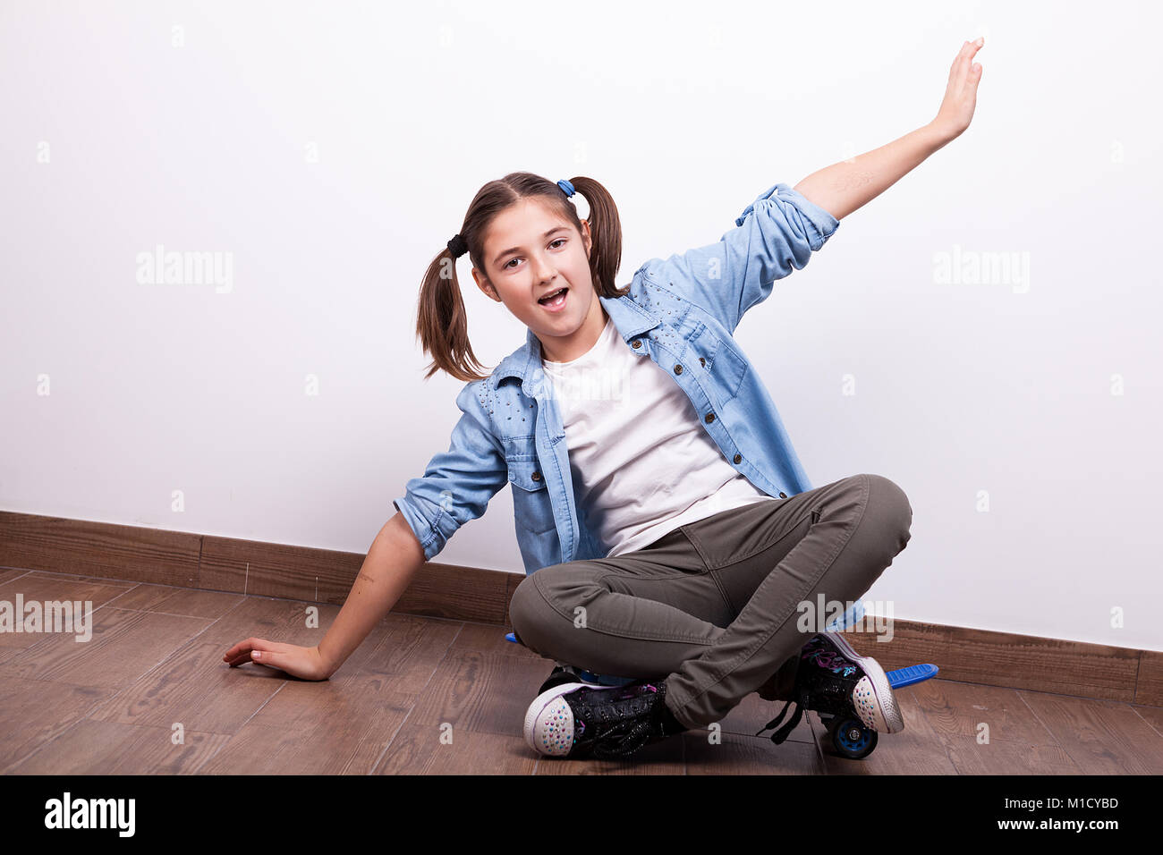 Active teenager girl on a skateboard Stock Photo - Alamy