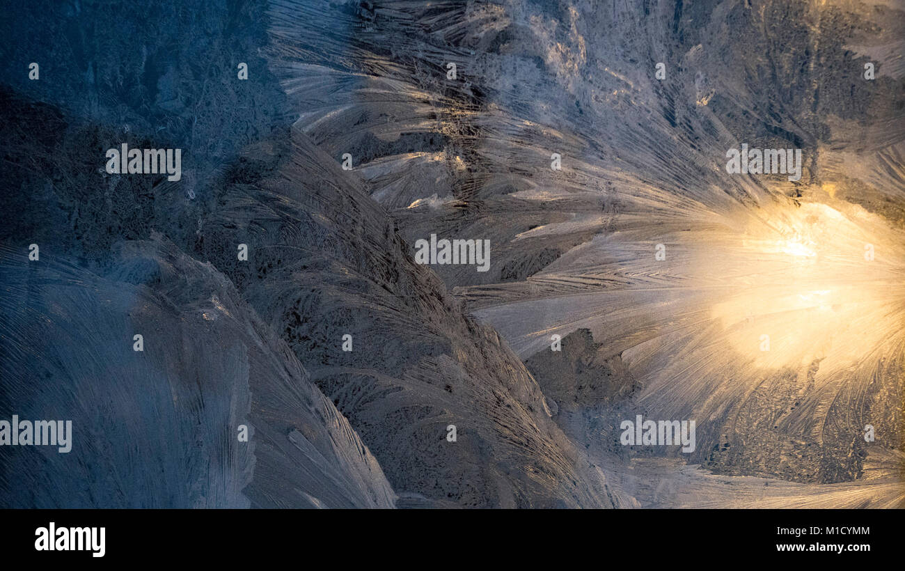 Light behind frozen window Stock Photo - Alamy