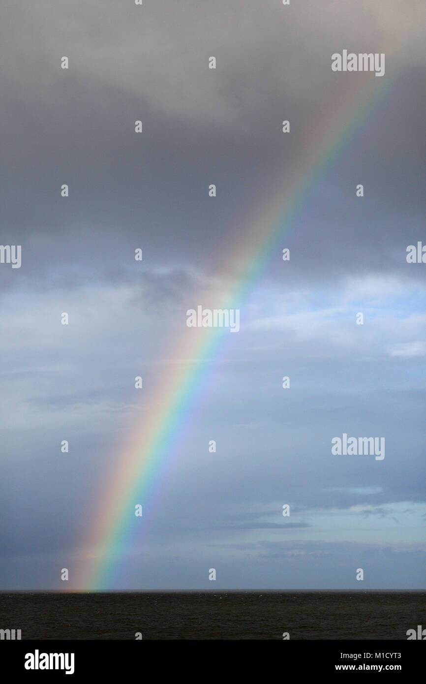 Rainbow over the sea Stock Photo - Alamy