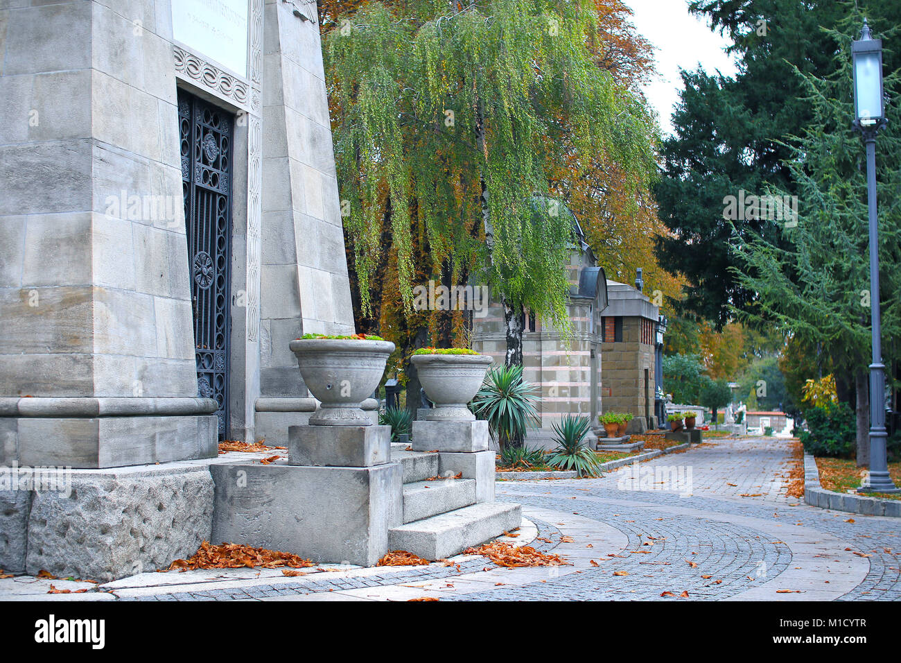 Graveyard path in the autumn Stock Photo - Alamy