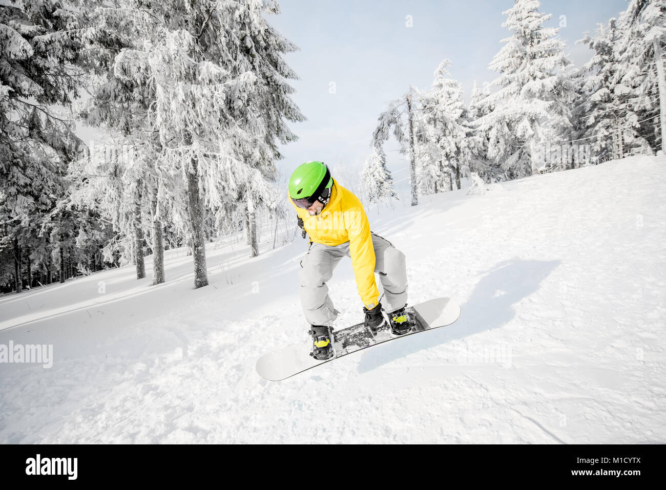 Man snowboarding at the mountains Stock Photo - Alamy