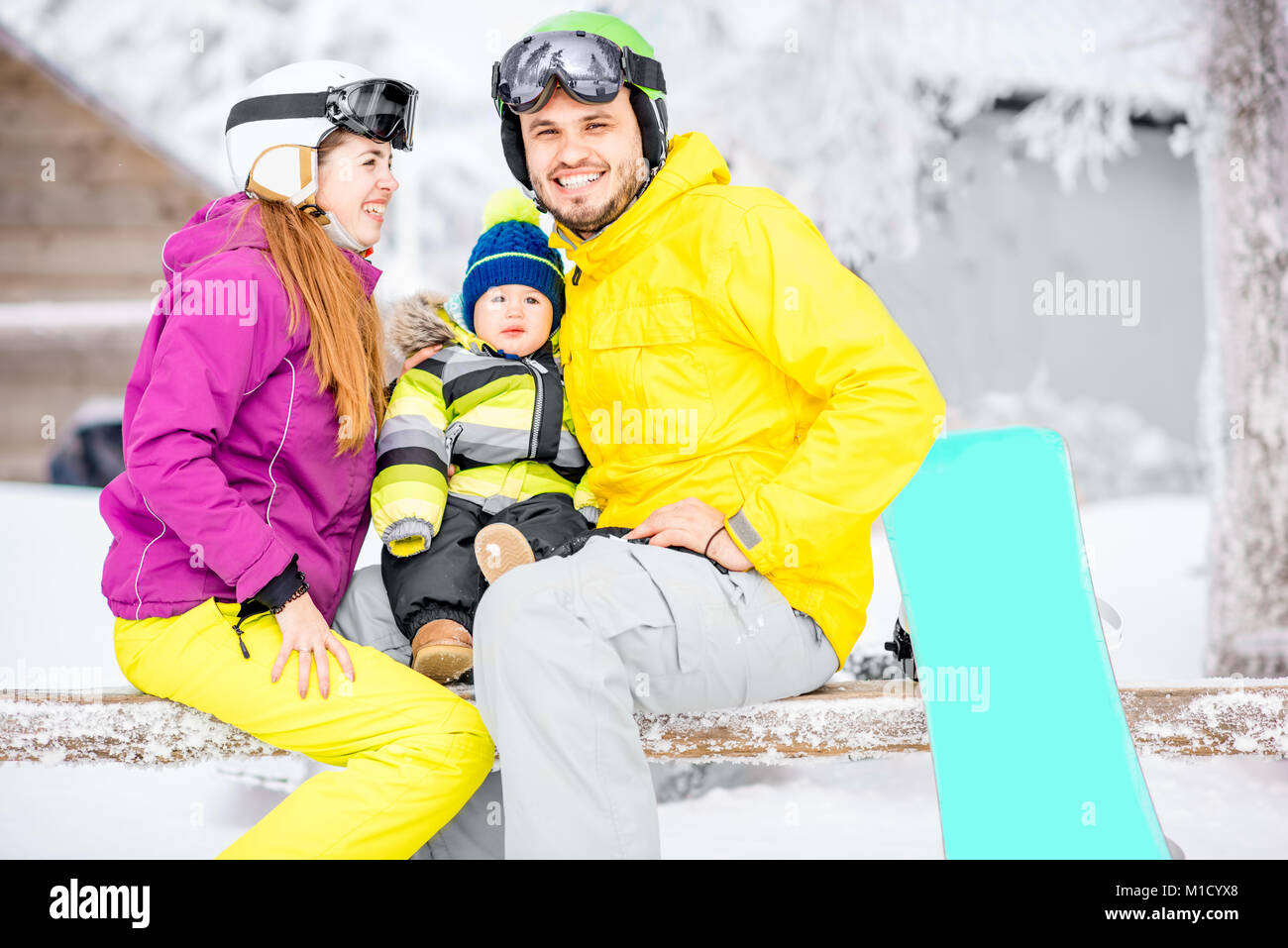 Happy family during the winter vacations Stock Photo - Alamy