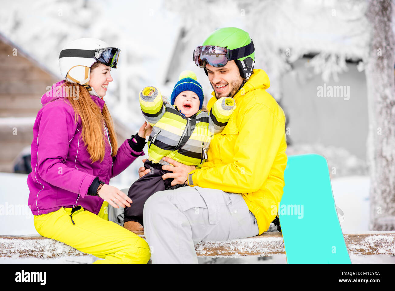 Happy family during the winter vacations Stock Photo - Alamy