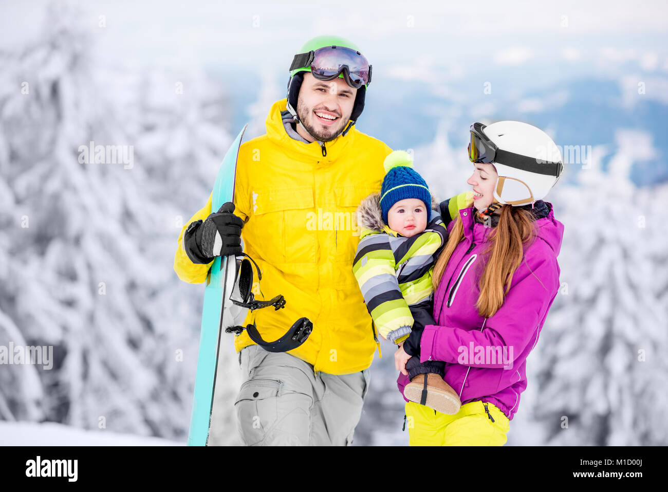 Happy family during the winter vacations Stock Photo - Alamy