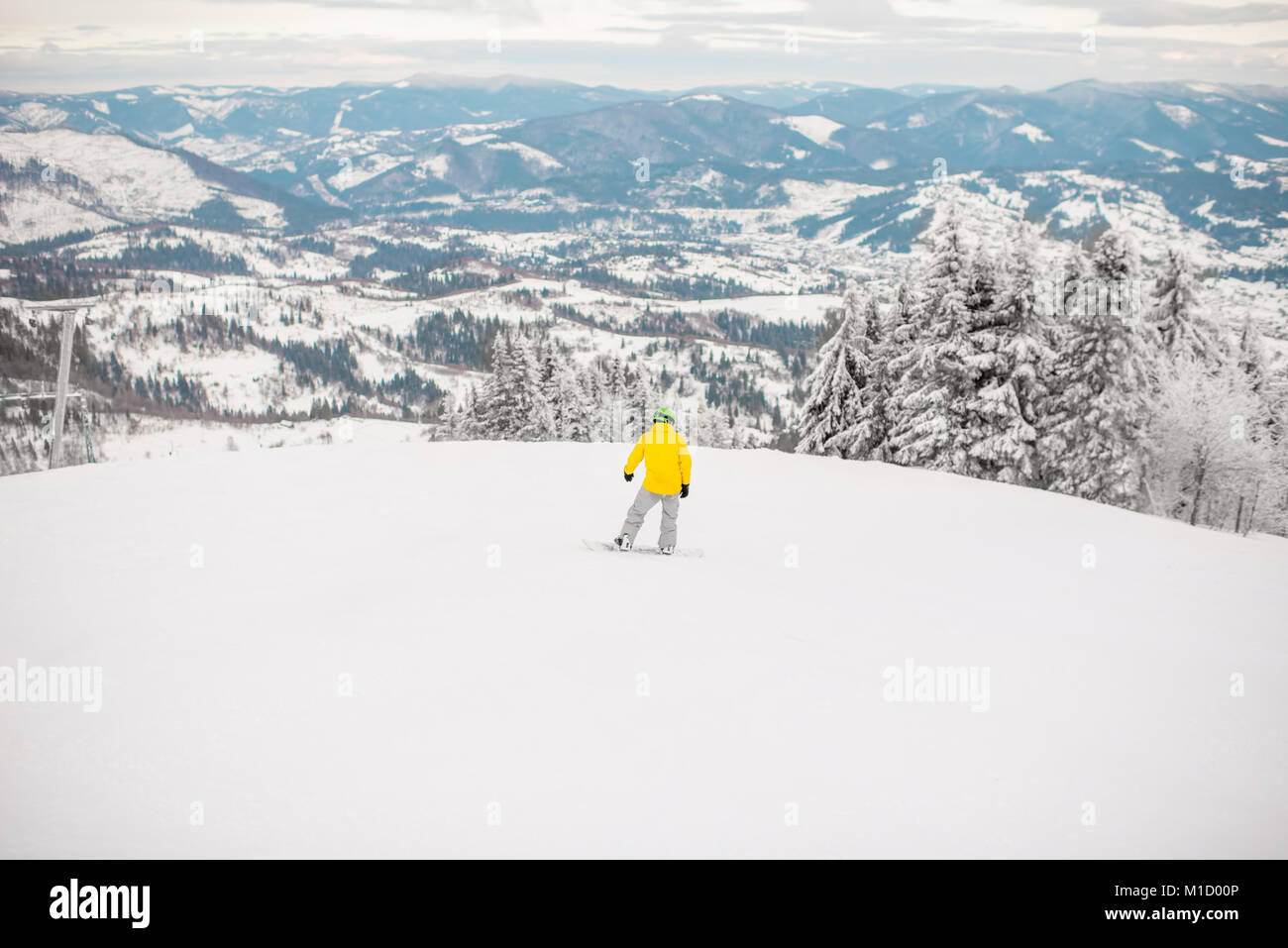 Man snowboarding at the mountains Stock Photo - Alamy