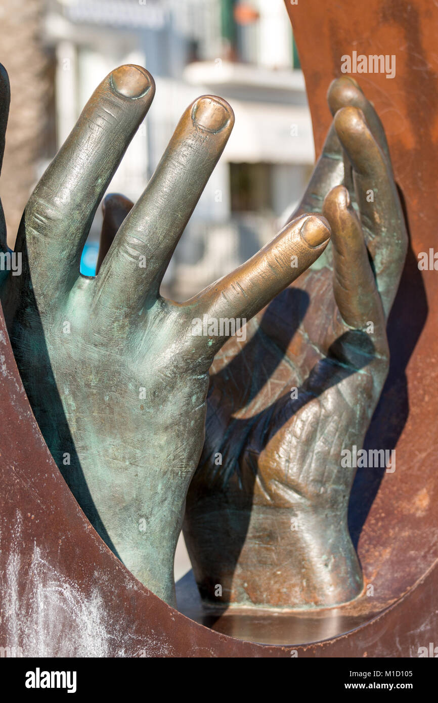 Sculpture of green hands in Sitges, in Spain Stock Photo - Alamy