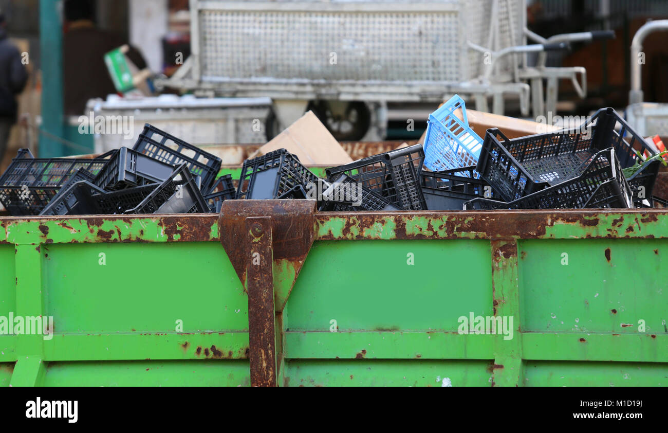container full of many garbage bags of city Stock Photo - Alamy