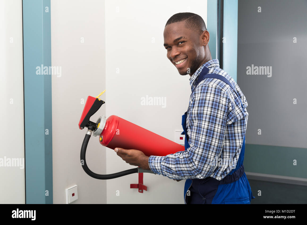 Red fire extinguisher inspection hi-res stock photography and images ...