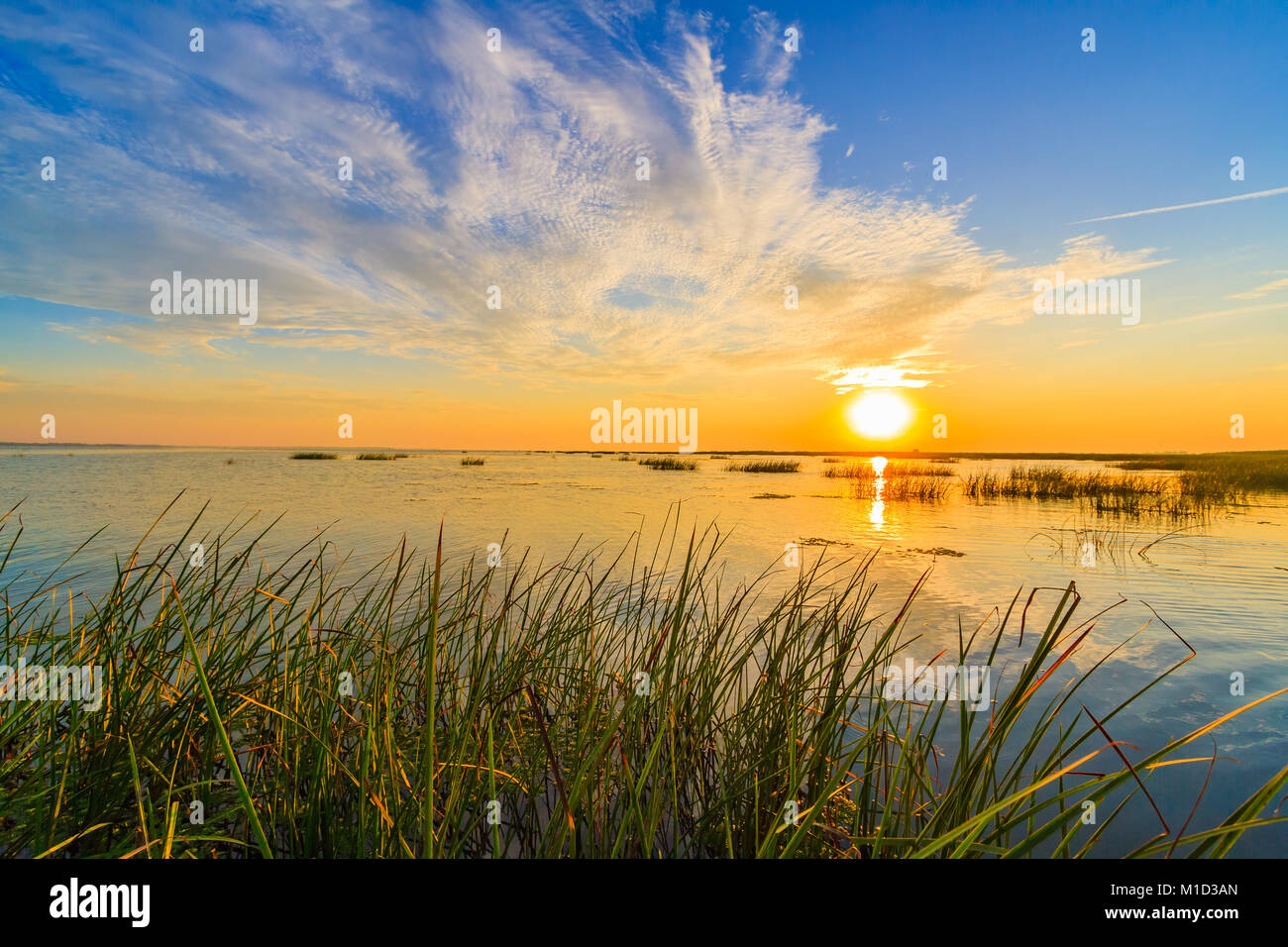 Sunrise colors in Danube Delta where Sulina Channel meet Black Sea in ...