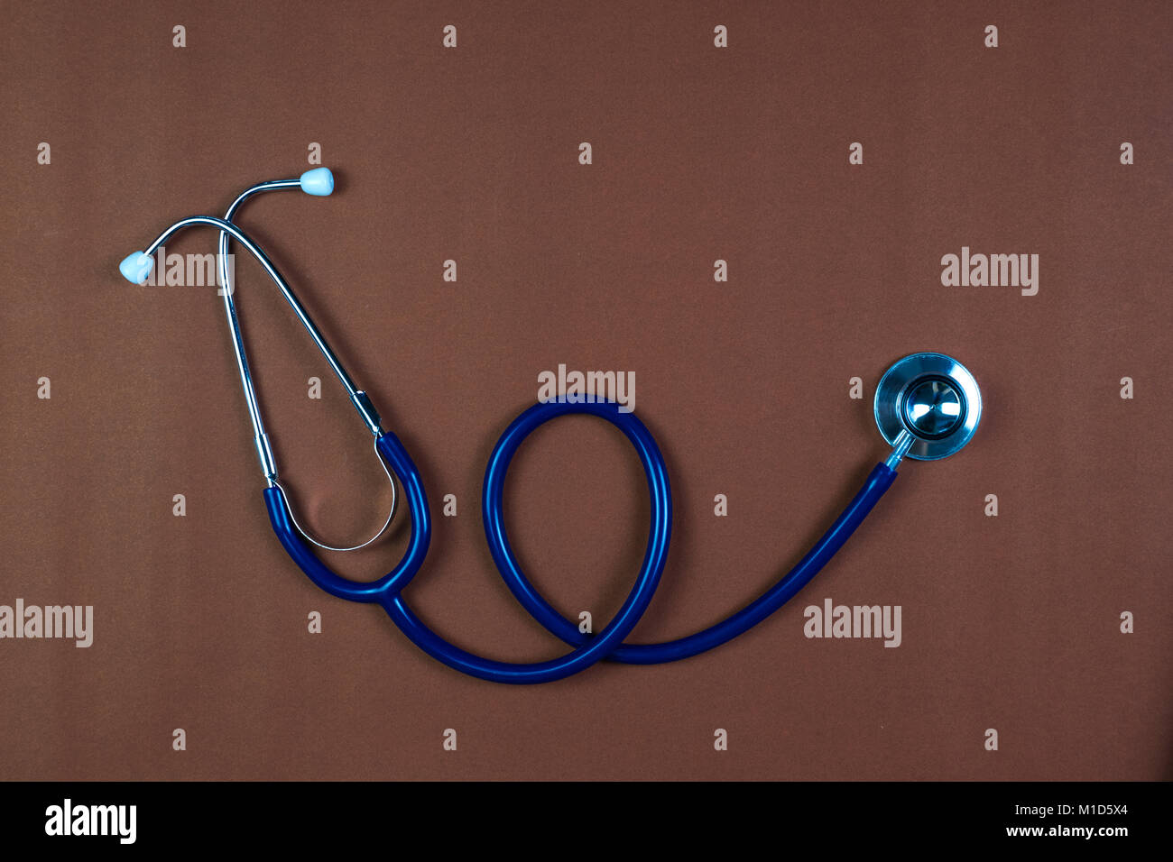 Stethoscope with blue tube on table top view with copy space. health ...