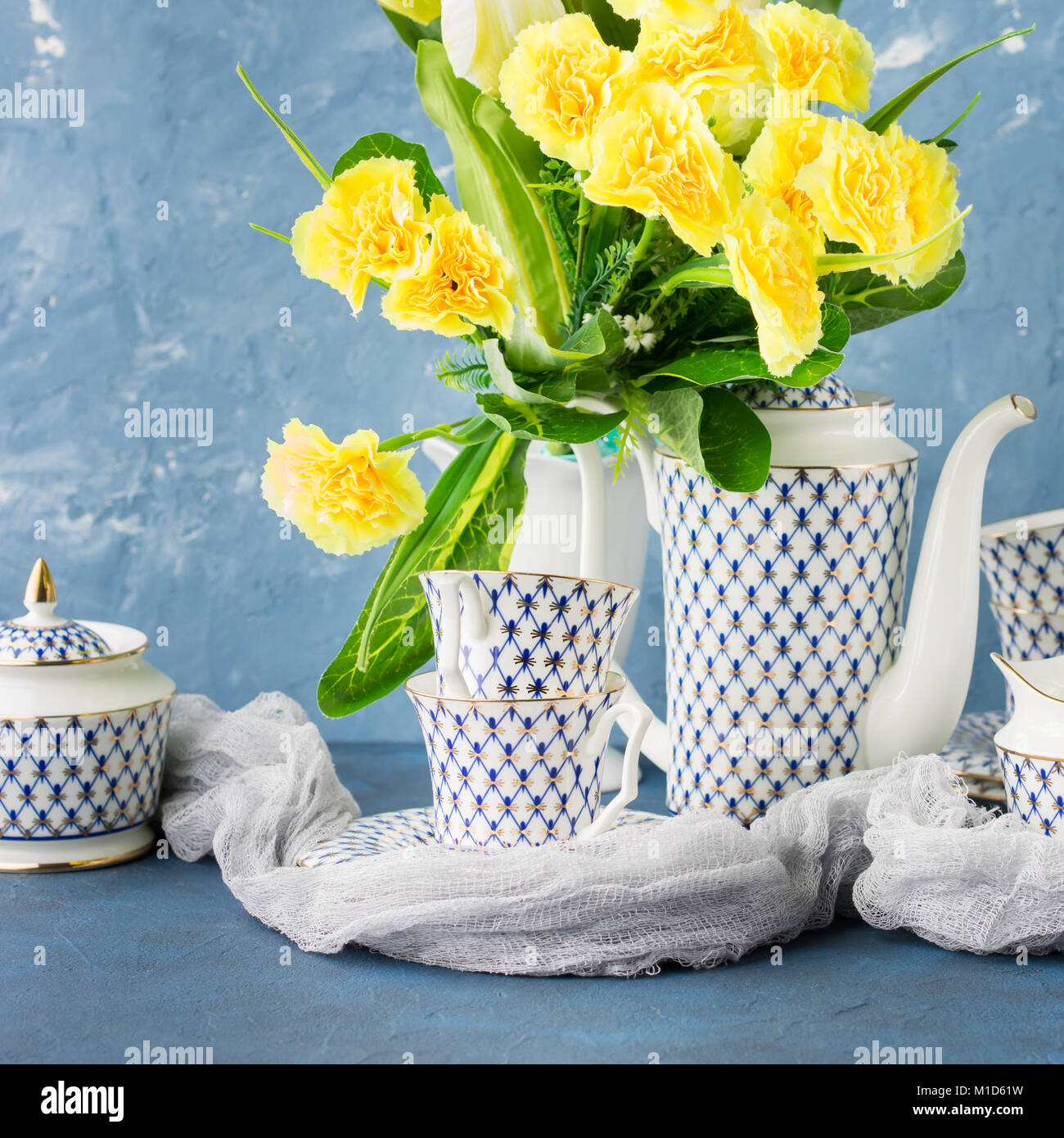 Coffee tea party china set and Easter pastel color yellow flowers on ...