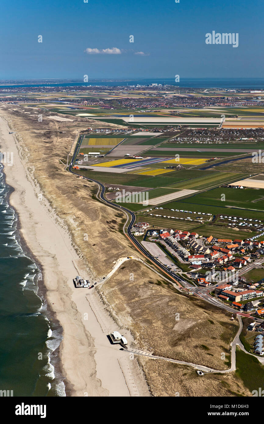 The Netherlands, Callantsoog, Aerial view of village, beach and beach ...
