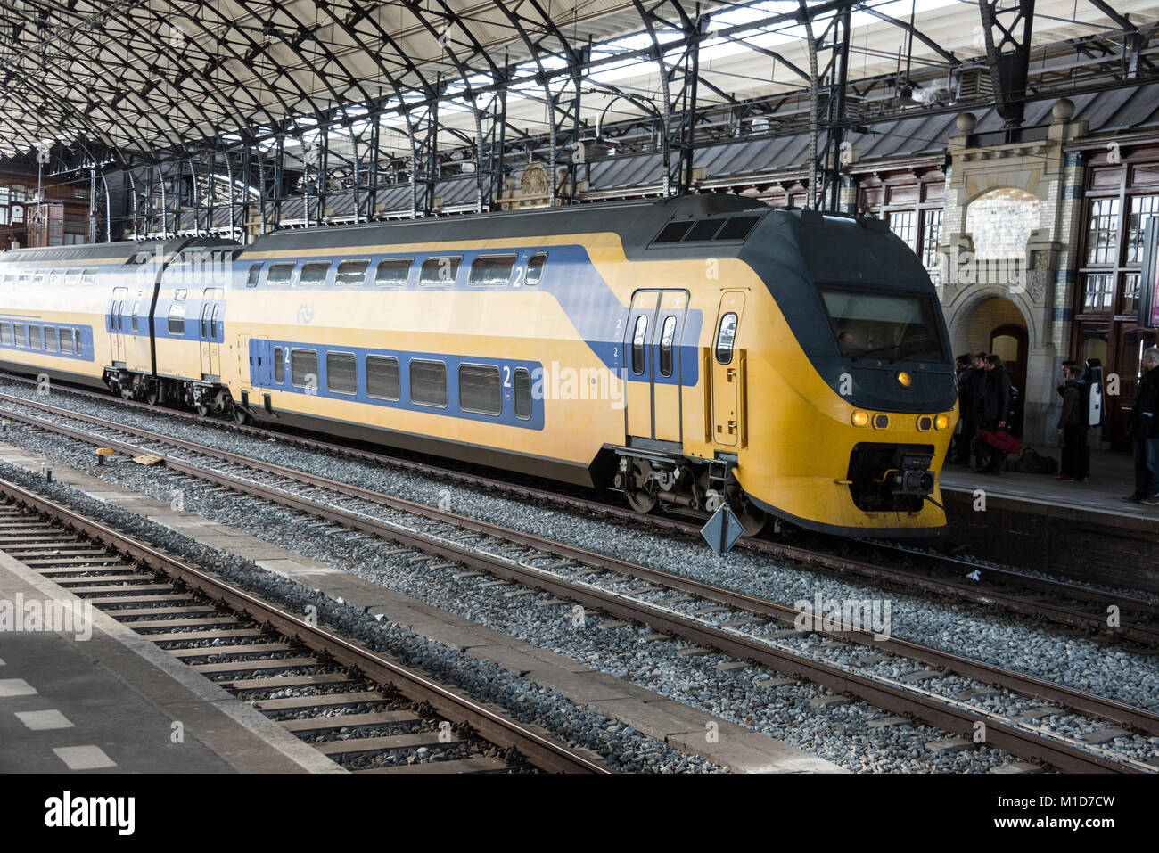 A NS VIRM double-deck train arrives at Haarlem main railway station in ...