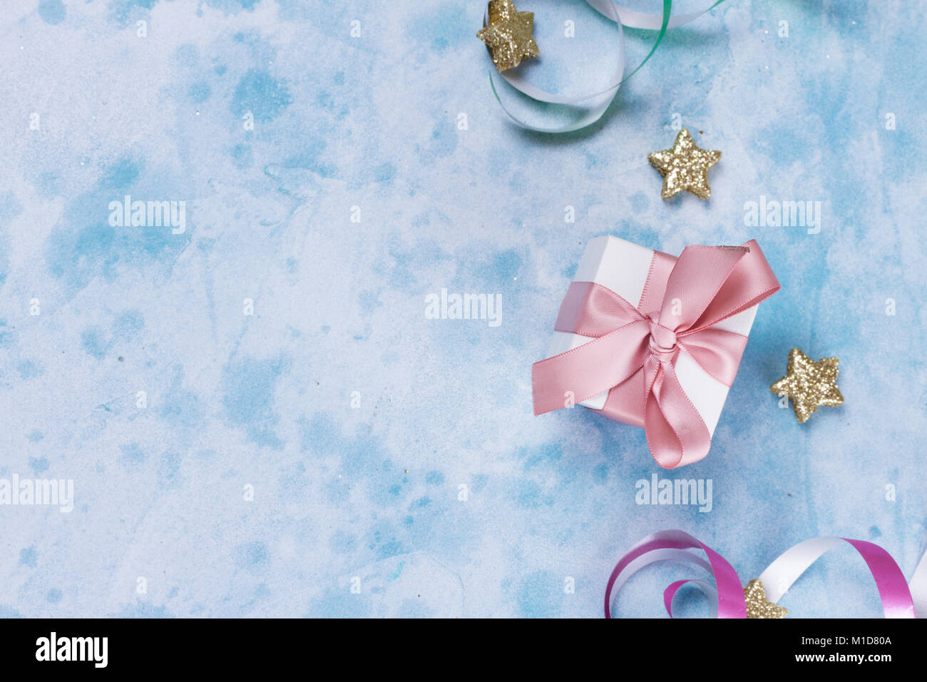 colorful carnival or party scene of gift box, streamers and confetti on ...